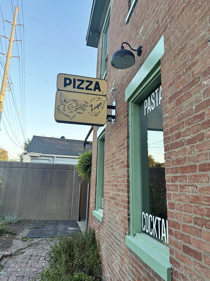 The simple "PIZZA" sign says it all - sometimes the best places need no fancy introduction.