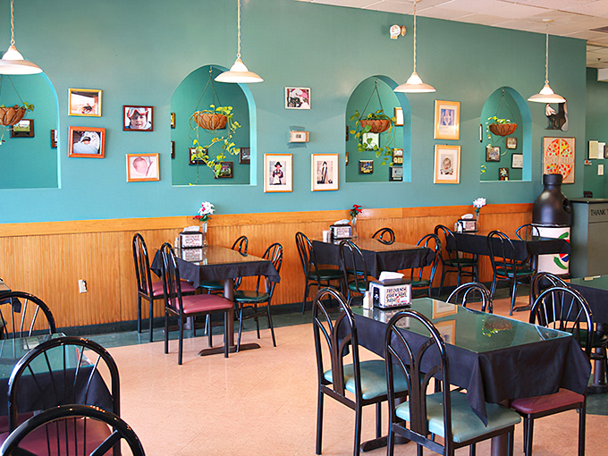 Those turquoise walls and hanging plants create the perfect backdrop for pizza that's anything but background noise.