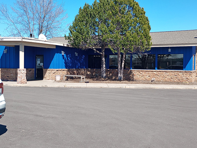 Blue walls, stone accents, and a sign promising your return. Sometimes the best restaurants aren't hiding at all.