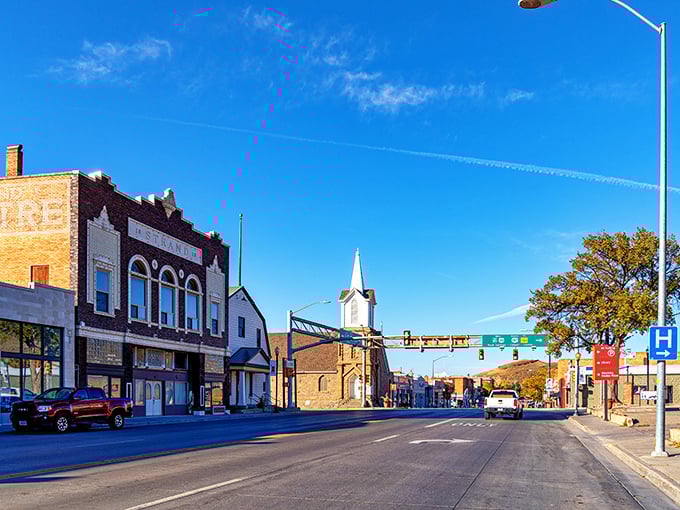 That church steeple watches over Rawlins' budget-friendly streets, where historic buildings and blue skies create the perfect Wyoming backdrop.