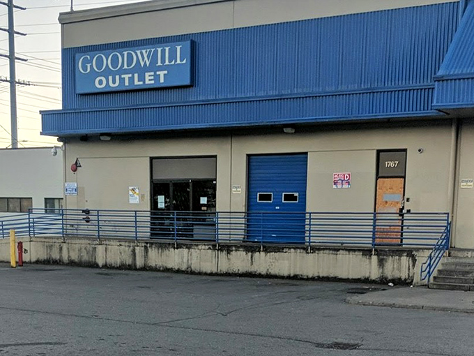 The blue-trimmed warehouse exterior hides a treasure trove of by-the-pound bargains waiting to be discovered.