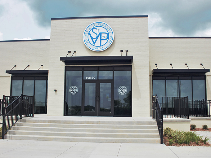 The blue and white logo welcomes you to a mission-driven treasure hunt where every purchase helps the community.