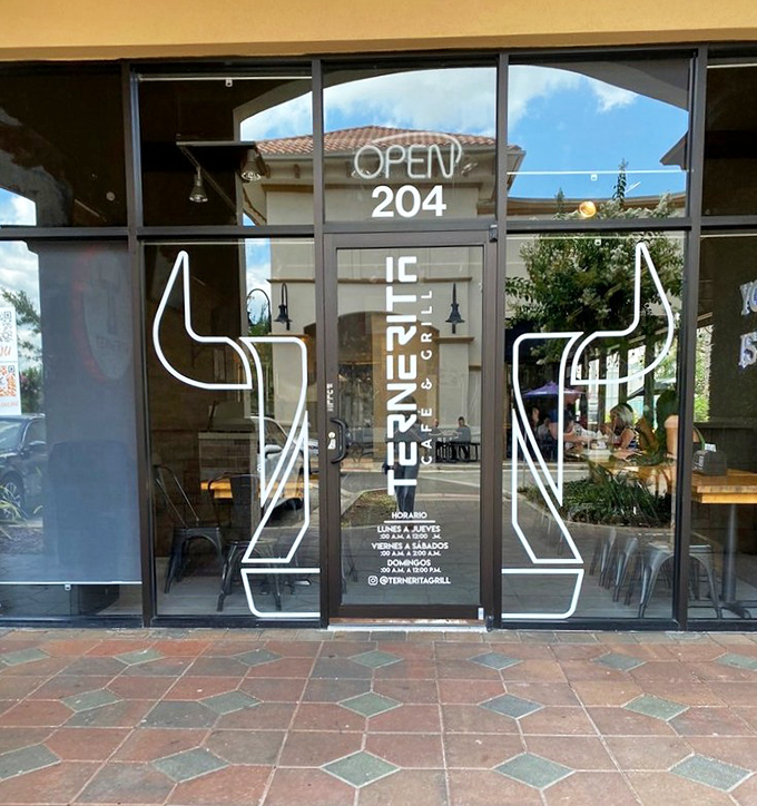 Those glass doors at Ternerita are portals to a world where Latin flavors transform ordinary steaks into extraordinary experiences.