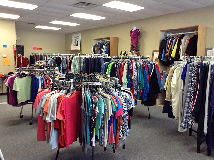 Circular racks create a carousel of fashion possibilities at The Big Thrift. Every spin reveals another affordable treasure!