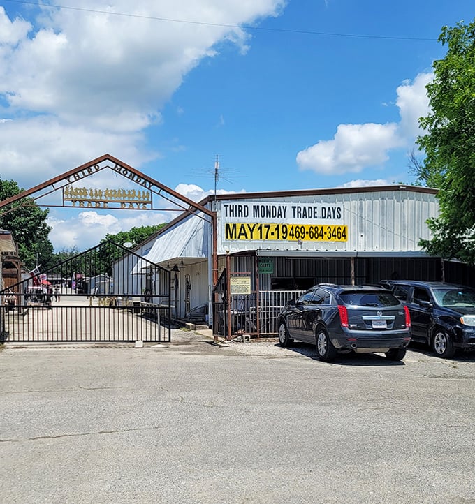 Trading post charm with modern treasures. Third Monday's sign announces upcoming market dates against a perfect Texas sky.