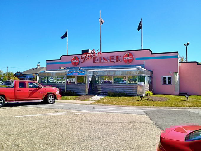Three flags wave proudly above this diner car, announcing that great American breakfast traditions live on here.