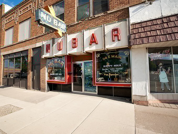 The famous Nu Bar's vintage neon sign beckons visitors like a beacon of authentic small-town hospitality.