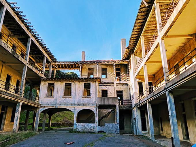 Sunlight plays architect through abandoned windows, creating a courtyard where history's echoes are louder than the footsteps of occasional visitors.