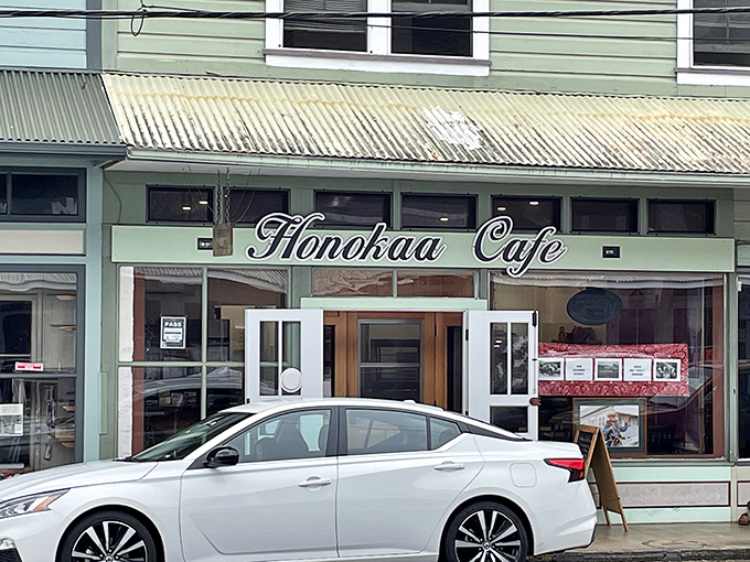 Andrade's Honokaa Cafe invites you in with its nostalgic signage, promising comfort food that tastes like someone's grandmother made it just for you.