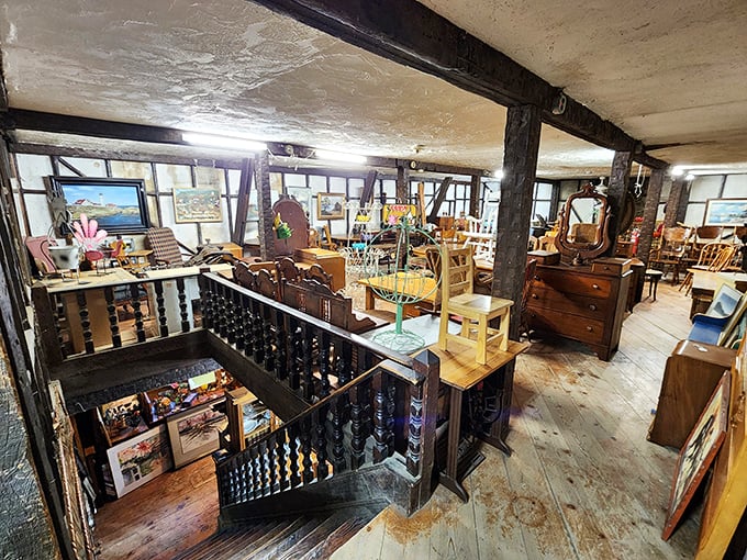 The upper level reveals furniture treasures arranged like a period film set. That staircase has witnessed countless "I've been looking everywhere for this!" moments.