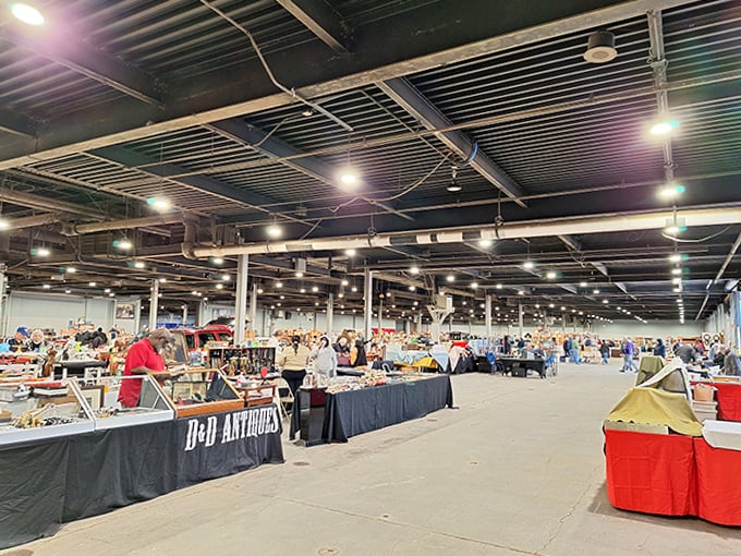 The serious business of antiquing happens under these industrial lights. Vendors arrange their treasures like museum curators with rent to pay.