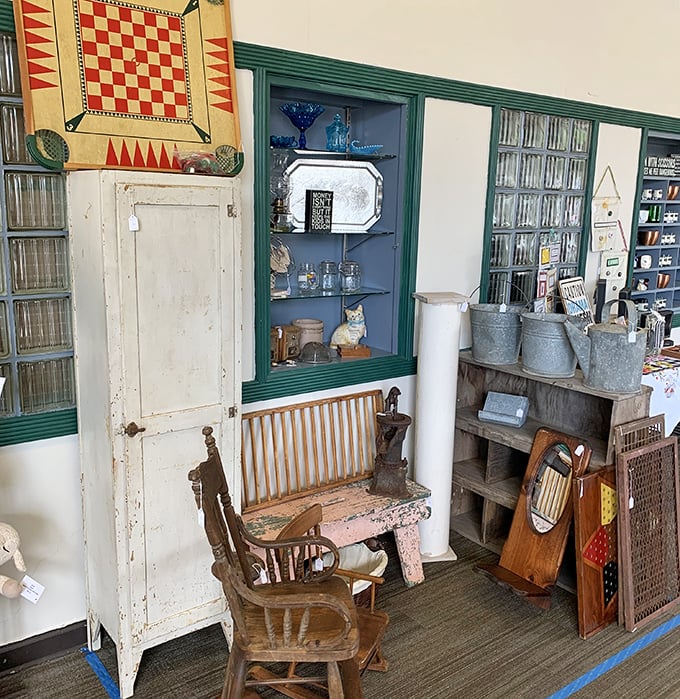Weathered white cabinet meets distressed blue display&mdash;the patina of age creating beauty money can't manufacture. Farmhouse chic before it was trendy.