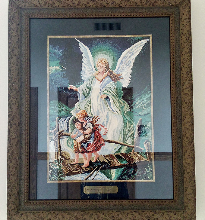 This ornate framed angel artwork could be gracing someone's wall by dinnertime&mdash;thrifting sometimes delivers unexpected beauty.