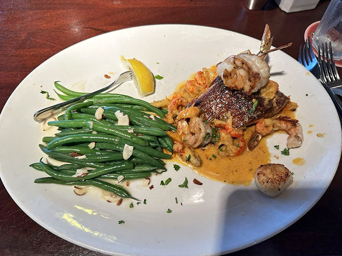 Fish meets its perfect match in this salmon dish, where green beans stand at attention alongside a sauce worth writing home about.