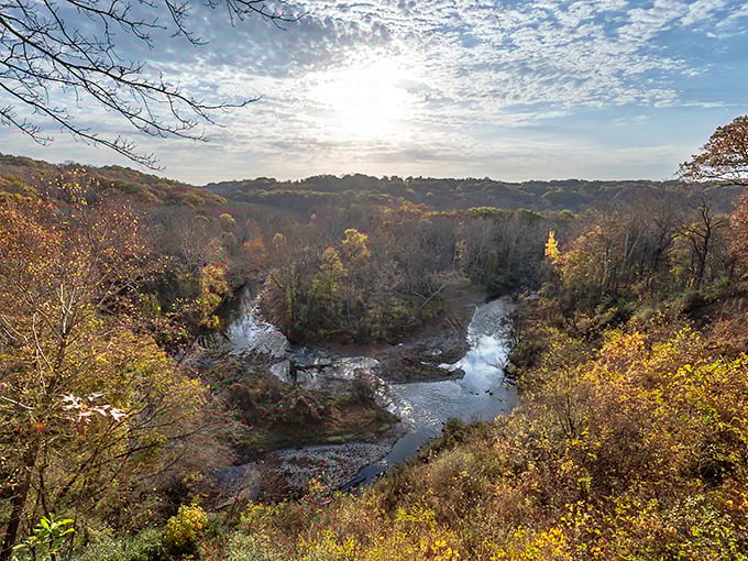 Fall's grand finale puts on a spectacular show from this vantage point. The river below seems to flow through liquid gold.