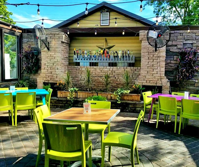 Vibrant lime chairs against rustic stone&mdash;Ava's outdoor patio proves that al fresco dining isn't just about the food, but the atmosphere that feeds the soul.