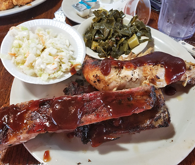 BBQ ribs glistening with sauce, flanked by perfect coleslaw and collard greens &ndash; the holy trinity of Southern comfort.