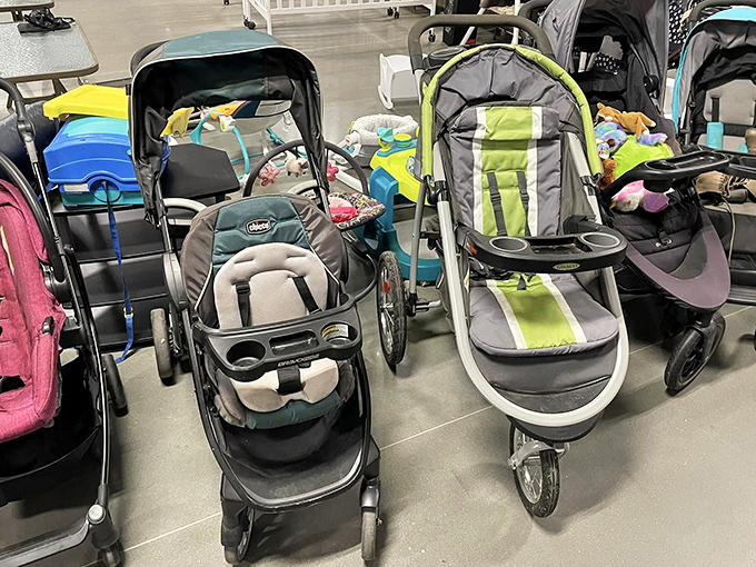 The stroller brigade stands ready for deployment, these gently-used chariots waiting to transport a new generation of tiny commanders on neighborhood expeditions.