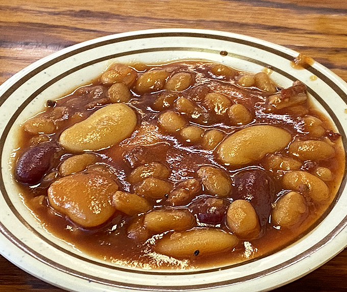 These aren't your sad, straight-from-the-can baked beans. They've clearly mingled with barbecue drippings in a slow dance of sweet and smoky.