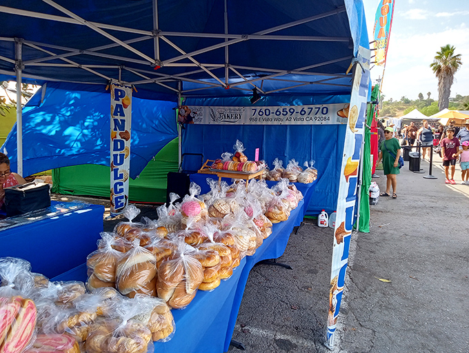 Fresh-baked pan dulce lined up like edible soldiers, their plastic-wrapped goodness promising a sweet companion to your morning coffee.