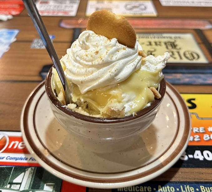 Banana pudding topped with a vanilla wafer stands as proof that dessert doesn't need complexity when it has soul.
