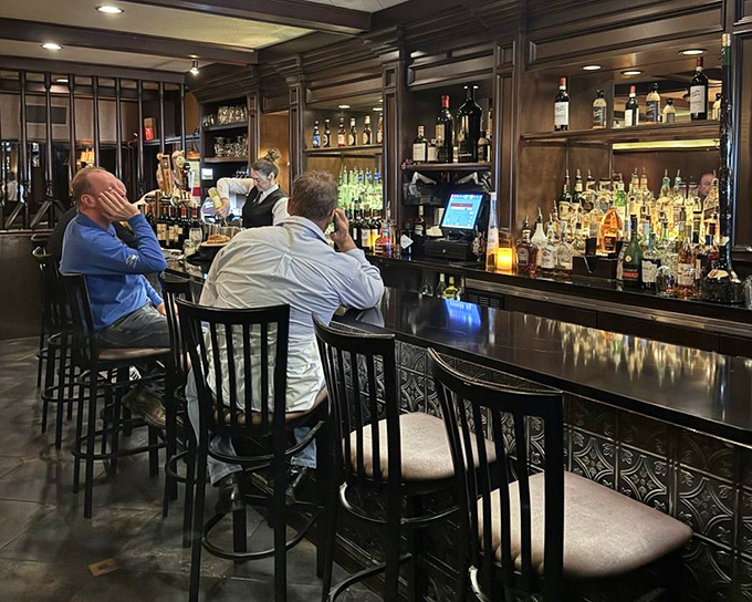 Where spirits meet spirited conversation. This elegant bar isn't just serving drinks&mdash;it's crafting liquid companions for your Italian feast.