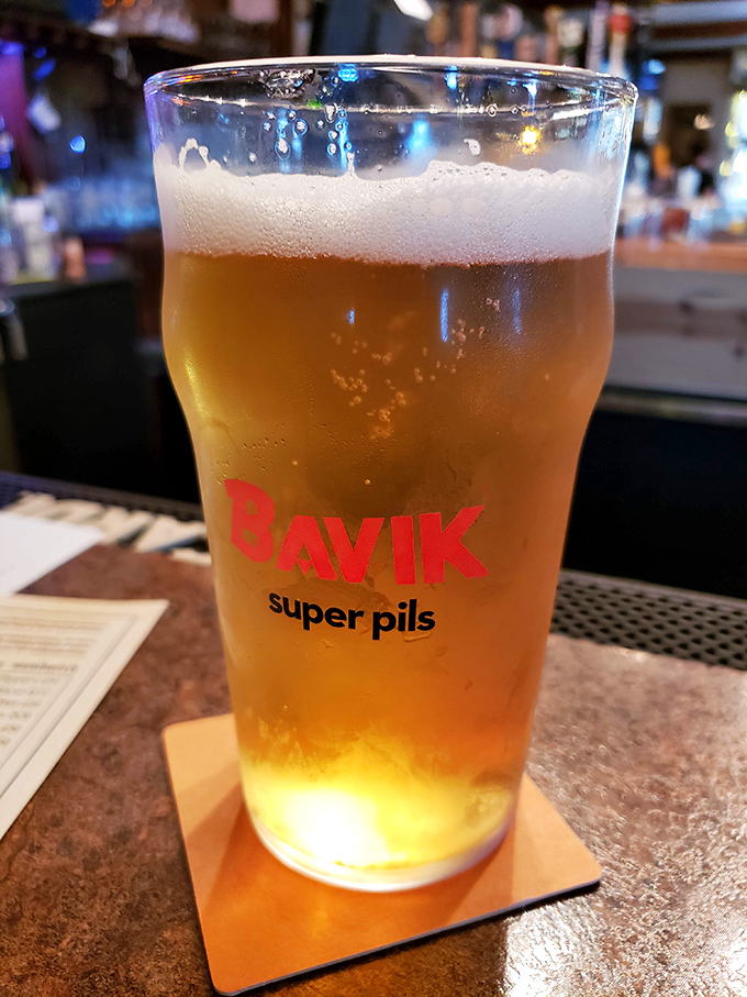 Nothing complements tavern fare like a properly poured beer&mdash;this Bavik pilsner looking like liquid sunshine in a glass, with just the right amount of foam.
