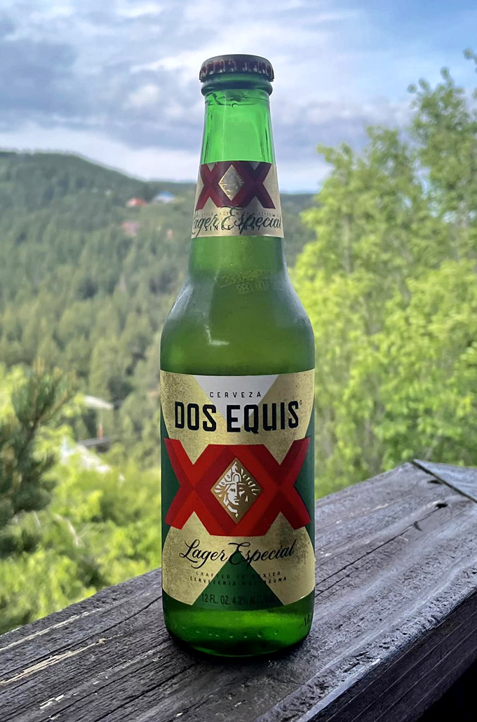 Nothing complements high-altitude barbecue quite like an ice-cold Dos Equis with a view that makes even the beer feel inadequate.