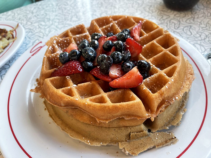 Belgian waffles topped with fresh berries&mdash;because sometimes you need to pretend your breakfast has nutritional value while enjoying every decadent bite.