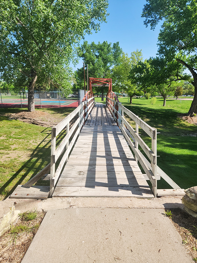 McKinley Park's historic bridge welcomes walkers to shaded pathways where the biggest traffic jam involves ambitious squirrels.