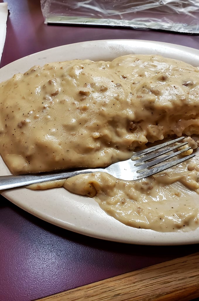 Gravity-defying sausage gravy blankets a waiting biscuit like a warm Southern hug on a cold Appalachian morning.