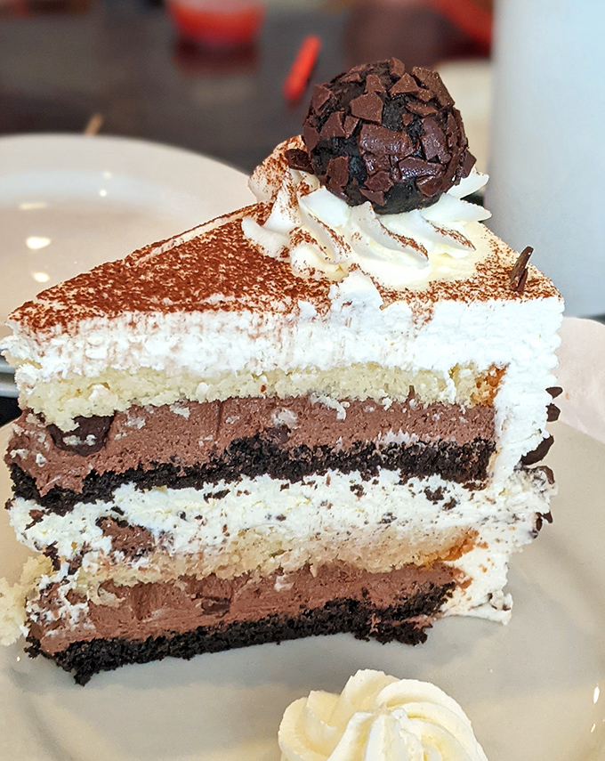 Black Forest cake so decadent it should require a permit – layers of chocolate, cream, and pure joy.