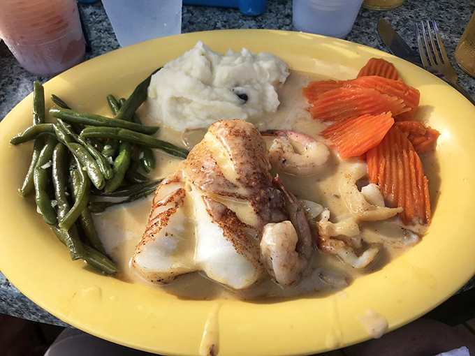 A plate that whispers "special occasion" without shouting it&mdash;fresh fish with vegetables that actually taste like vegetables.