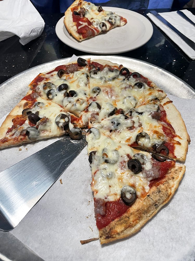 Black olives and sausage&mdash;the Fred Astaire and Ginger Rogers of pizza toppings, dancing across a stage of perfectly melted cheese.