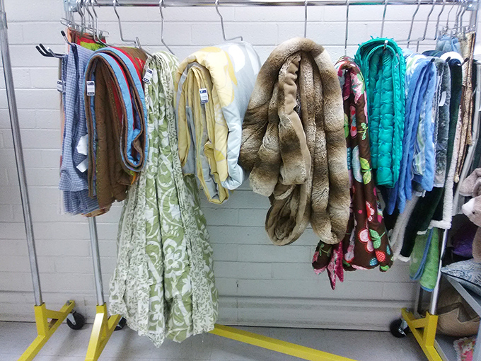 Cozy blankets and throws that have kept others warm now wait for new homes, like retired superheroes ready for one more mission.