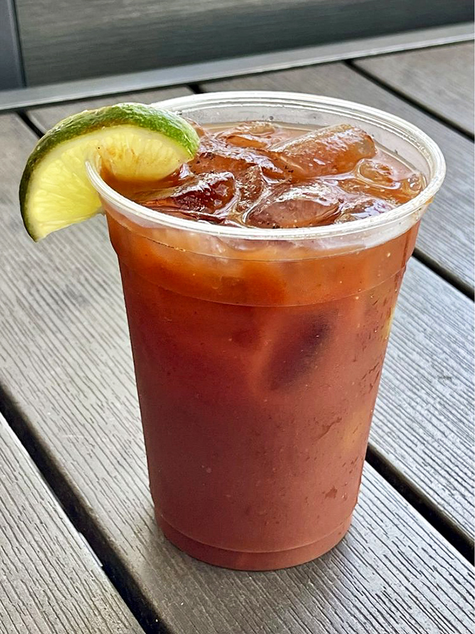 Florida in a glass: a Bloody Mary garnished with lime, served on a weathered deck&mdash;vacation in liquid form.