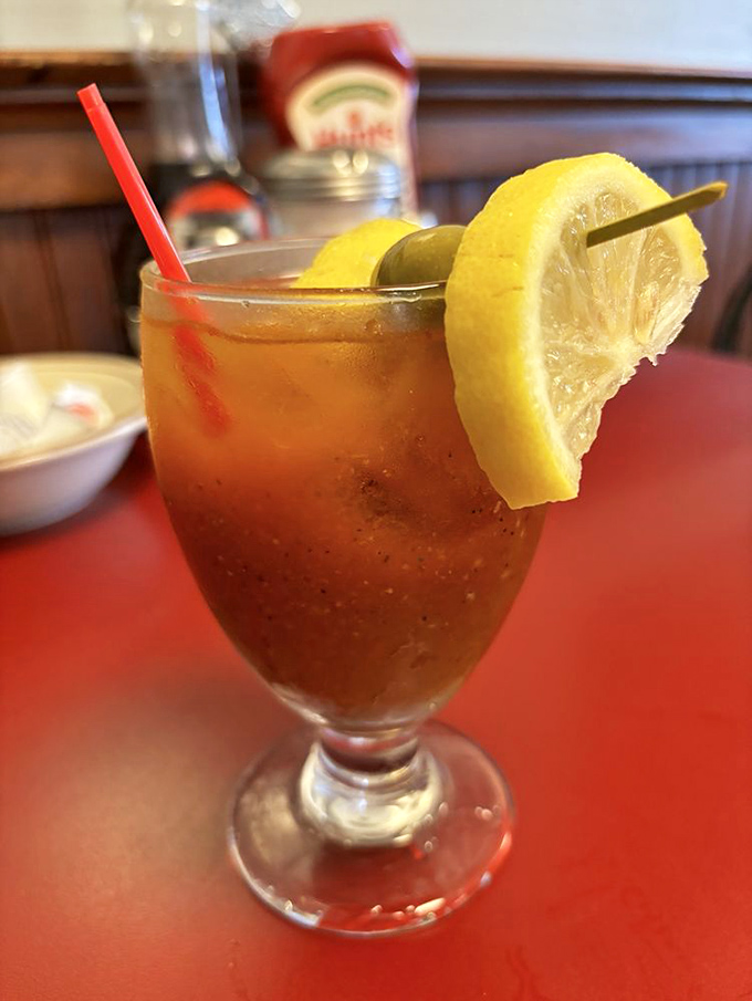 The Bloody Mary arrives like a spicy liquid salad, garnished with lemon and promising to cure whatever ailed you from the night before.