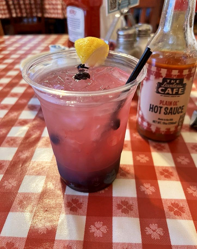 A berry-infused moonshine lemonade that's as pretty as it is potent. The South's answer to fancy cocktails.