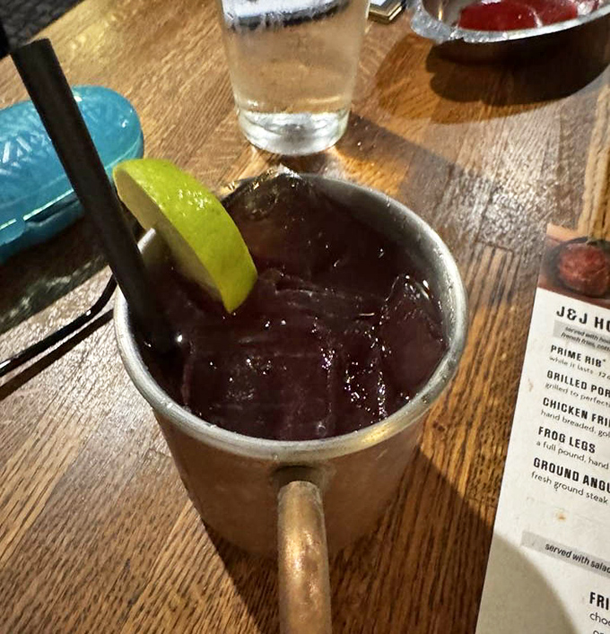 A proper Moscow Mule served in a copper mug—because even cowboys appreciate good cocktail presentation.