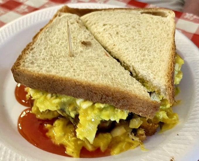 Simplicity elevated to art form. White bread, perfectly prepared meat, that signature mustard slaw&mdash;proof that greatness doesn't require complexity.