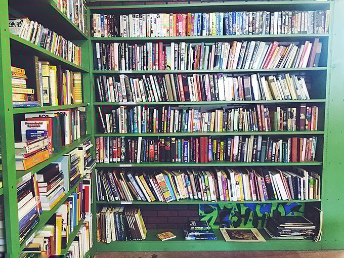 Floor-to-ceiling books creating a literary fortress where paperback dreams come true for pocket change.