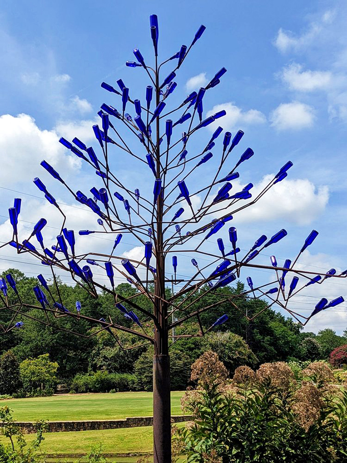 The bottle tree stands as proof that recycling can be art. Somewhere, a wine club is wondering where all their empties disappeared to.