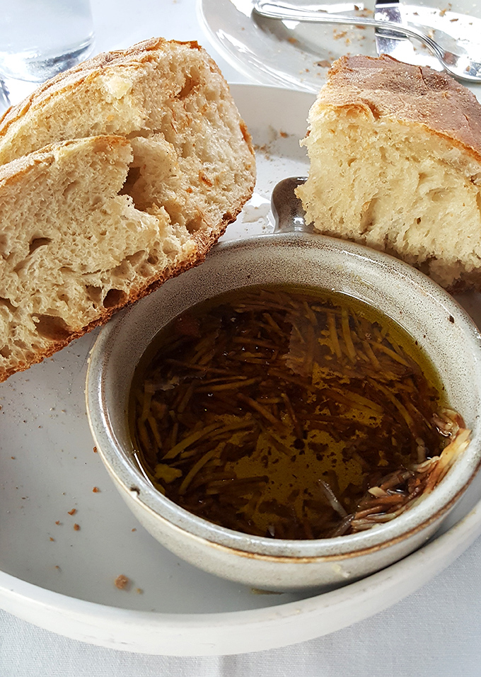 Freshly baked bread with herb-infused olive oil &ndash; the opening act that deserves a standing ovation. Carb-counting is officially suspended.