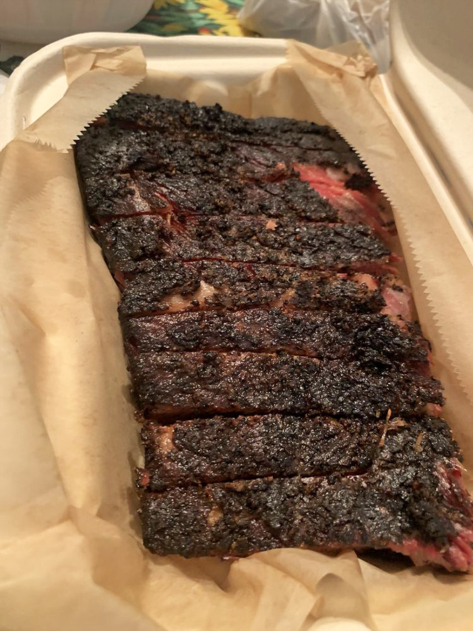 Sliced brisket with that coveted smoke ring&mdash;the pinkish layer beneath the bark that signals proper smoking technique and makes BBQ enthusiasts weak at the knees.