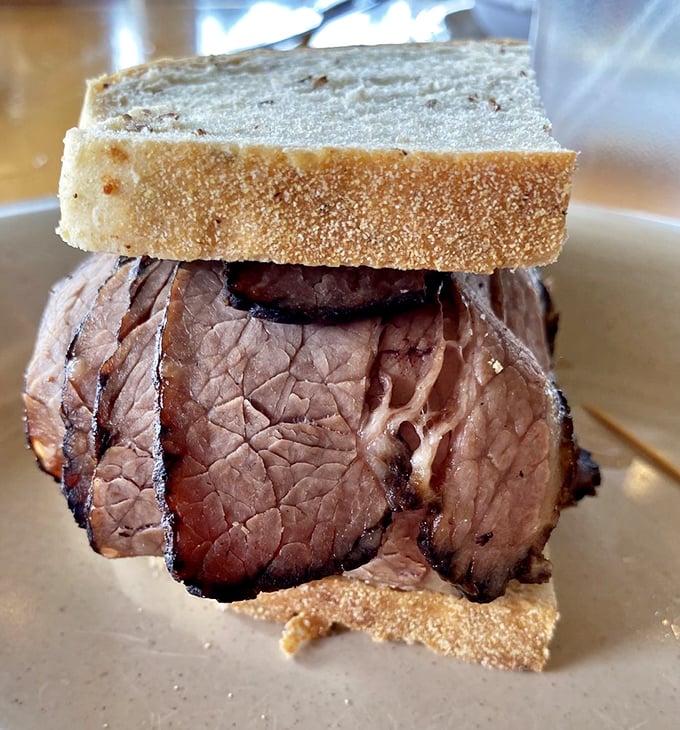 Brisket so tender it practically surrenders to the bread. This sandwich isn't just a meal; it's a masterclass in patience.