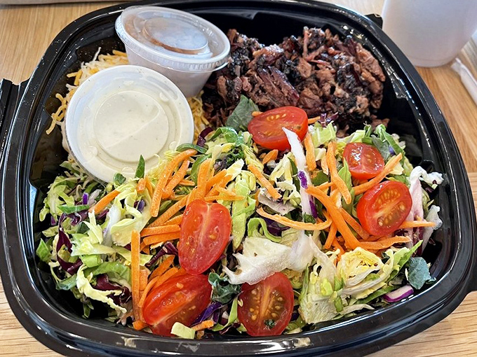 The holy trinity of barbecue: pulled pork, brisket, and sides that don't play second fiddle. Those beans look like they've been simmering since Tuesday.