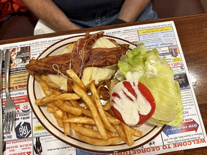 The classic American lunch trifecta: a hearty burger, crispy fries, and the satisfaction of knowing some traditions never need updating.