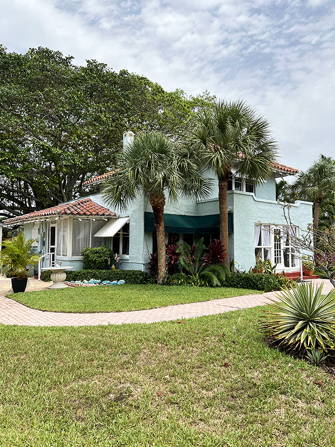 Old Florida charm preserved in pastel perfection. This historic home whispers stories of bygone eras before high-rises dominated the coastline.