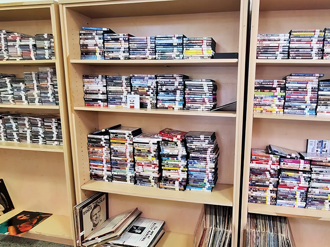 DVDs stacked like mini skyscrapers offer entertainment for pennies on the dollar&mdash;Netflix might be convenient, but can it beat these prices?