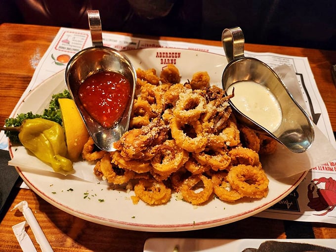 Calamari rings stacked like edible Olympics medals, each one competing for best supporting role to your beer.
